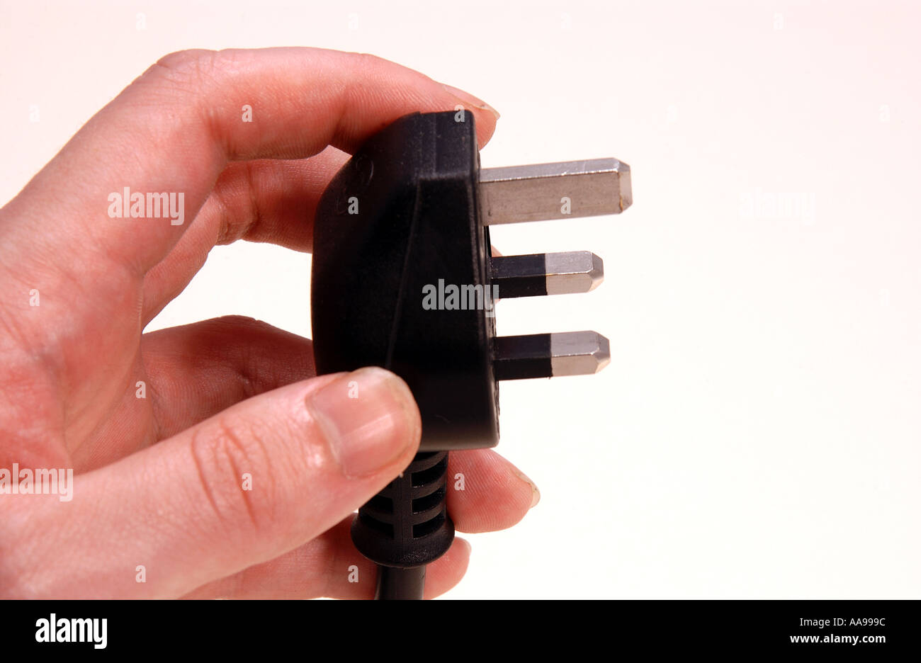 hand holding plug Stock Photo - Alamy