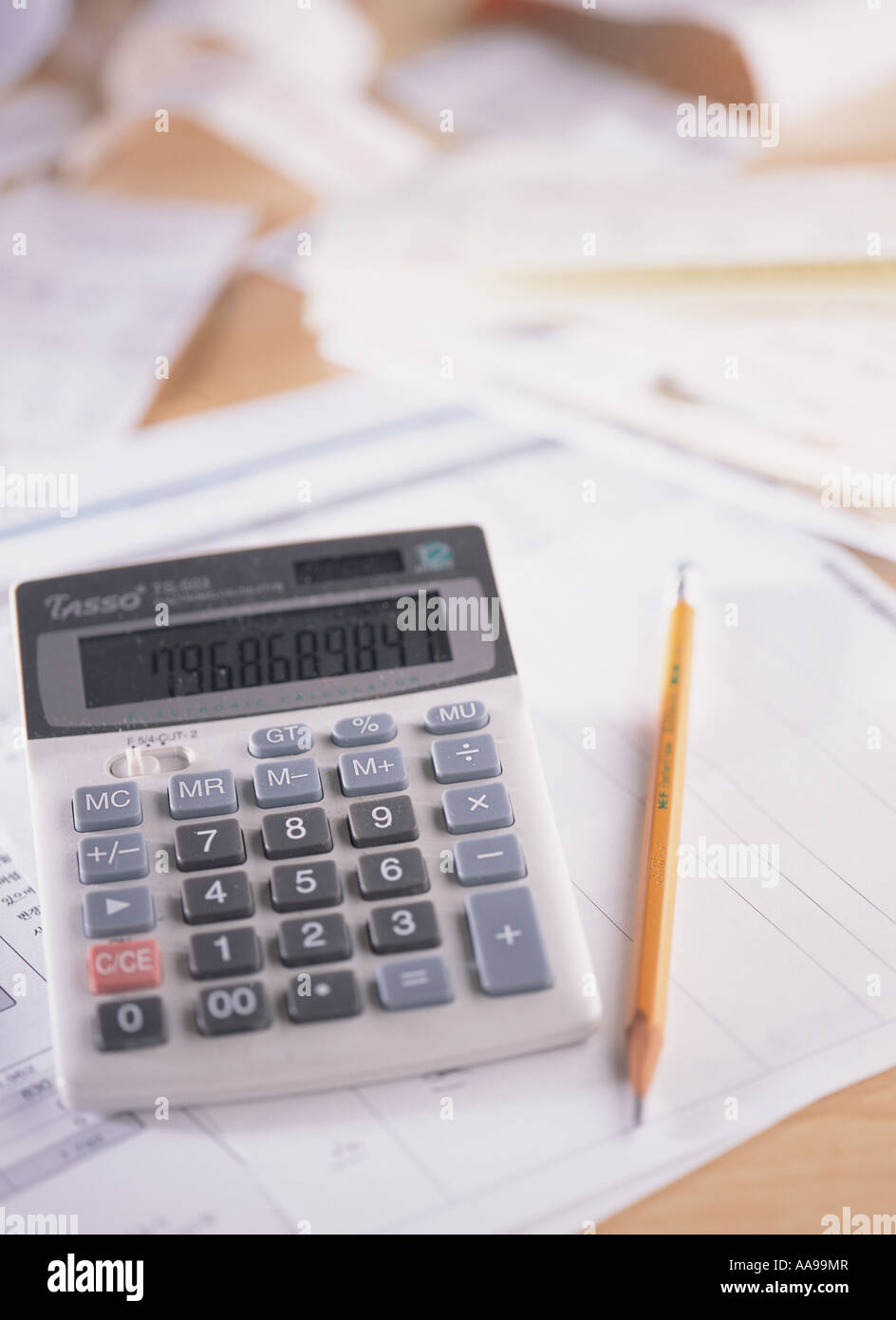 Calculator and pencil Stock Photo - Alamy