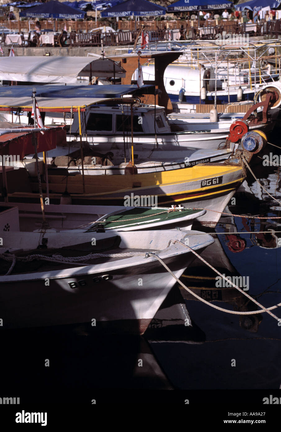 colourful fishing boats moored in Kyrenia harbour in North Cyprus Stock ...