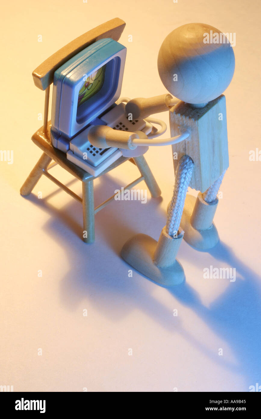 Wooden Figure and Toy Computer Stock Photo - Alamy