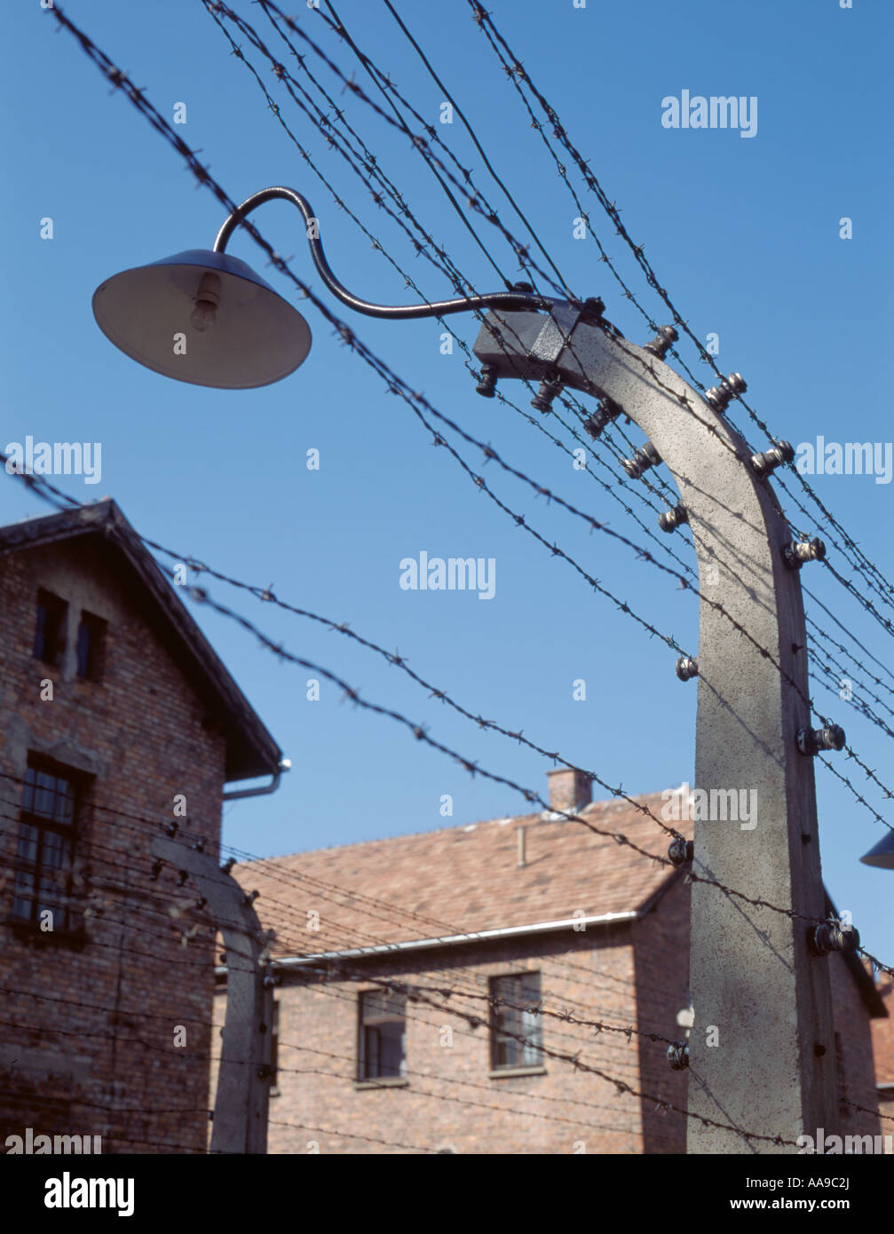 Detail of post supporting electric barbed wire fence and lamp ...