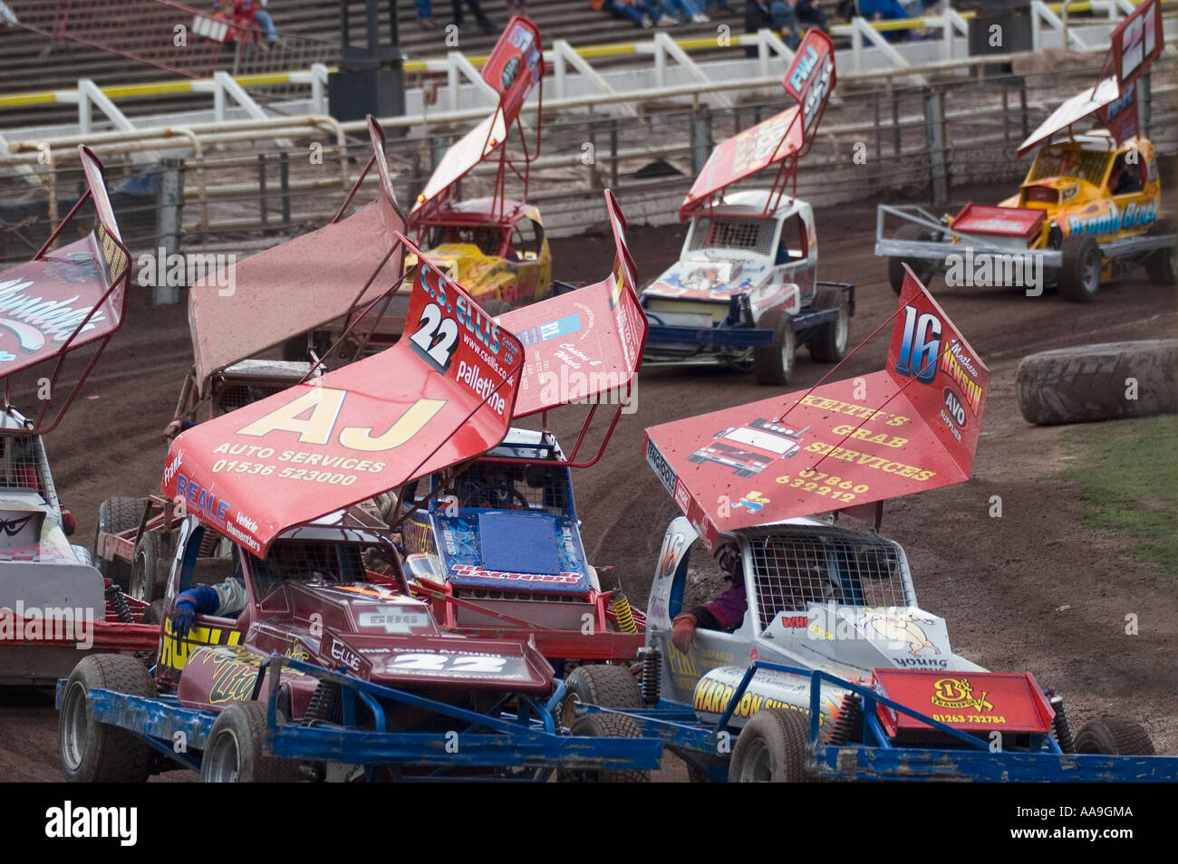 many stock cars racing around a dirt circuit Stock Photo - Alamy
