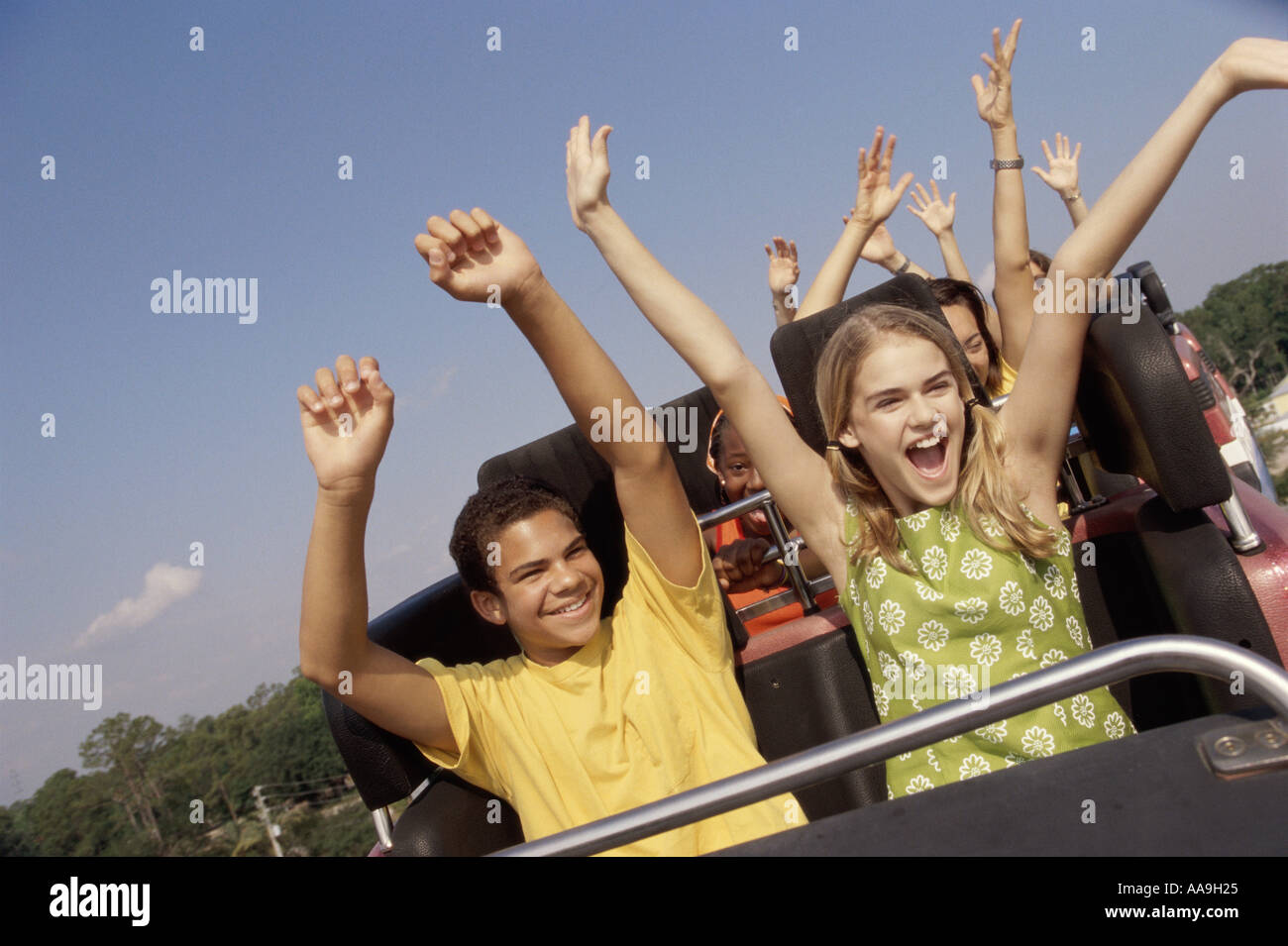Teenage couple on a roller coaster ride Stock Photo - Alamy