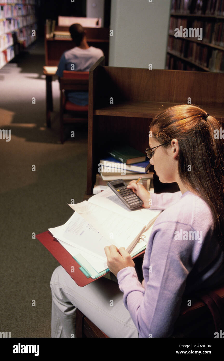 High angle view of a teenage girl studying in a library Stock Photo - Alamy