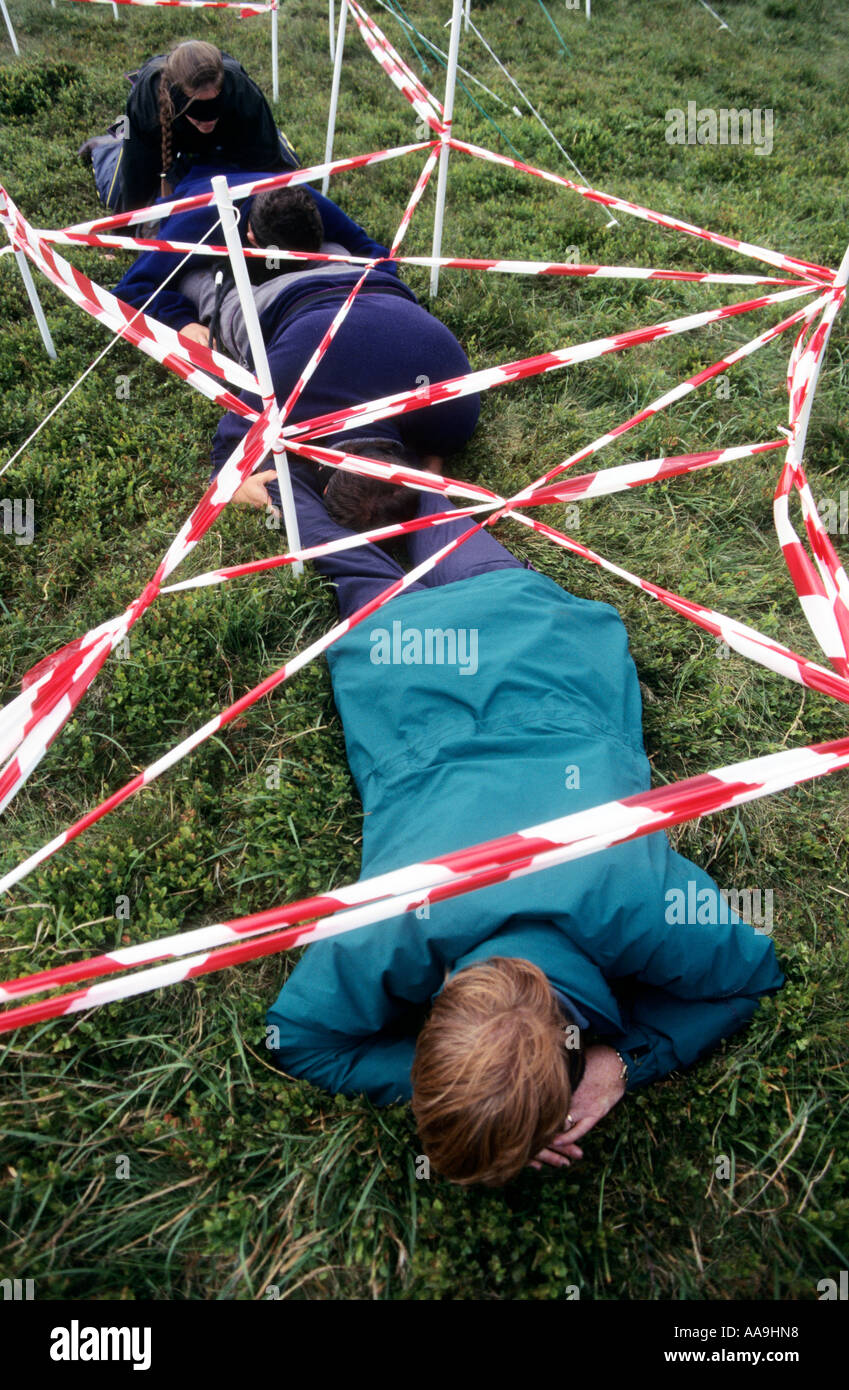 Management training course game crawling under tape obstacles to help ...