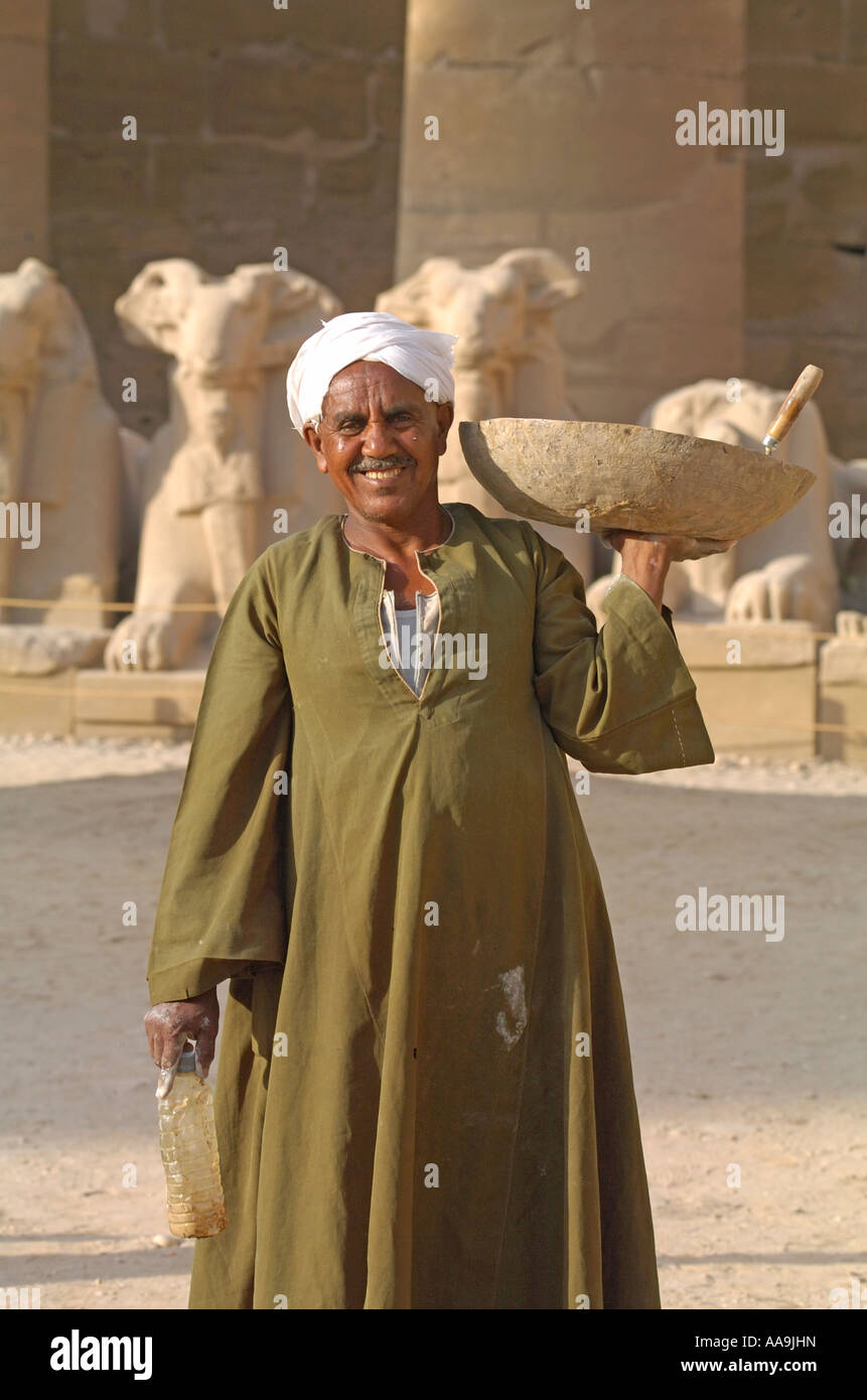 Egyptian temple worker at the Temple of Karnak, Luxor, Egypt, North ...