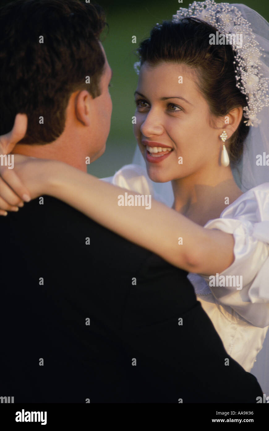 Bride hugging her groom Stock Photo - Alamy