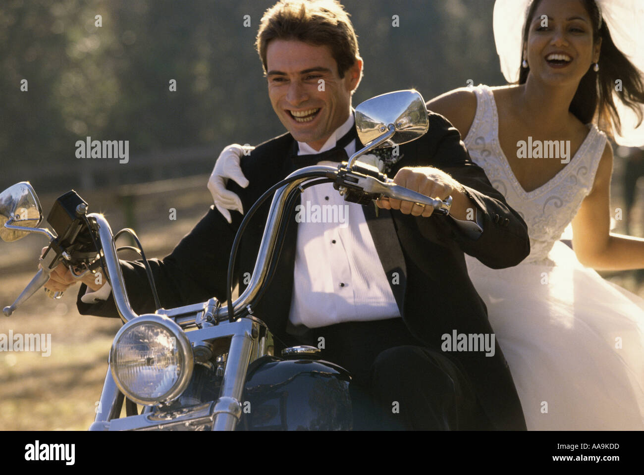 Bride and bridegroom on a motorcycle Stock Photo - Alamy
