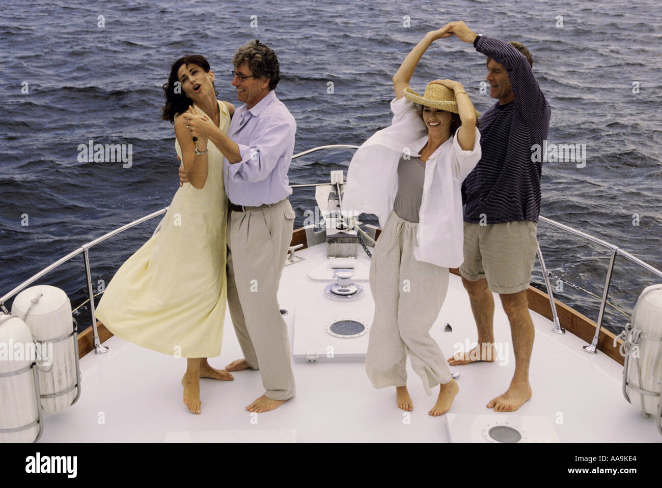 Two couples dancing on a boat Stock Photo - Alamy