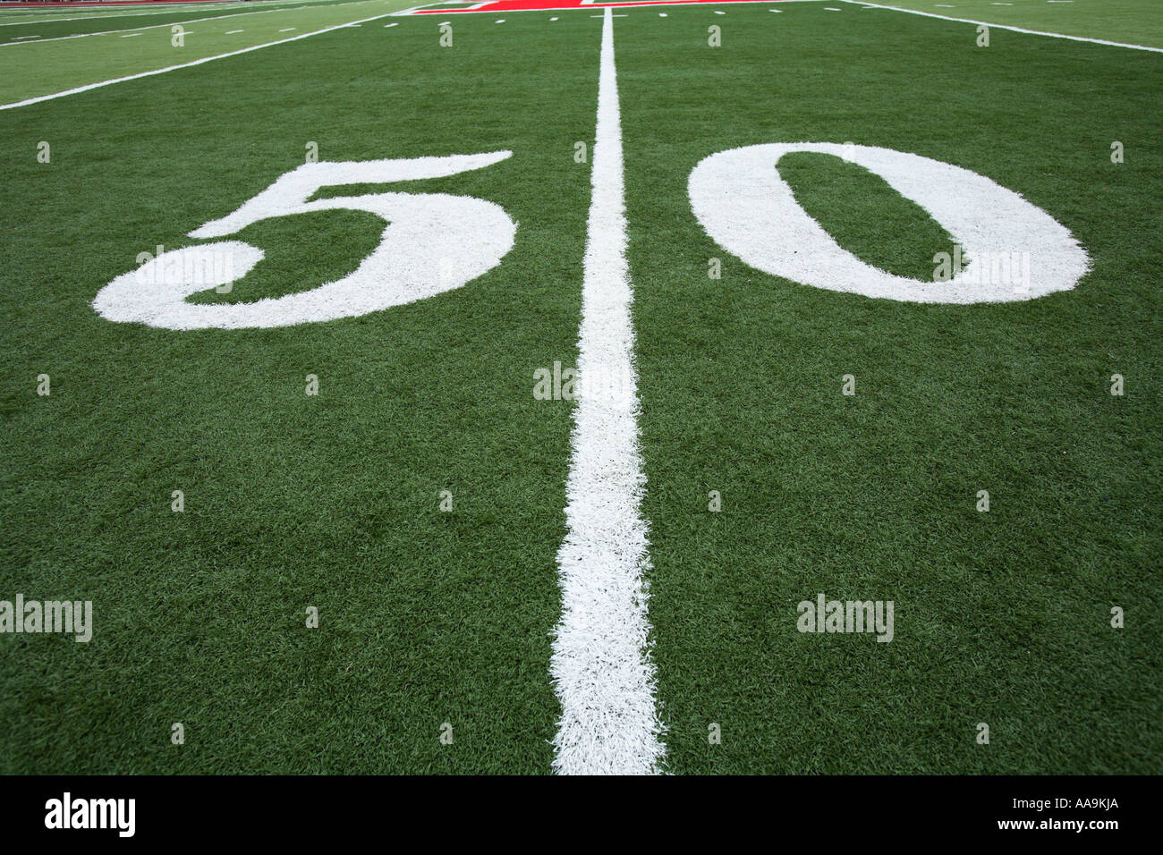 Fifty yard line on football field Stock Photo - Alamy