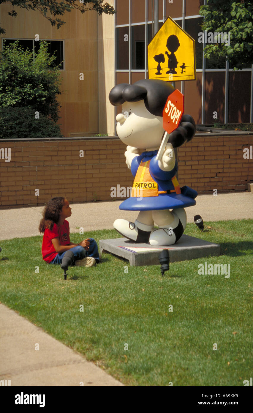 Young black girl looking at "Peanuts" statue. St. Paul, Minnesota Stock ...