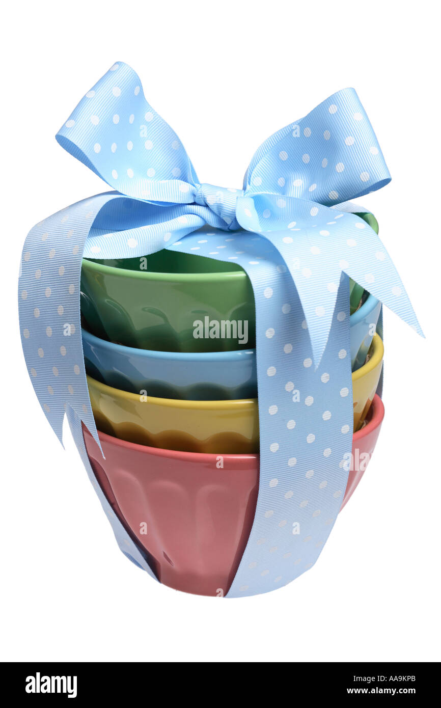 Stack of colorful bowls with ribbon Stock Photo - Alamy