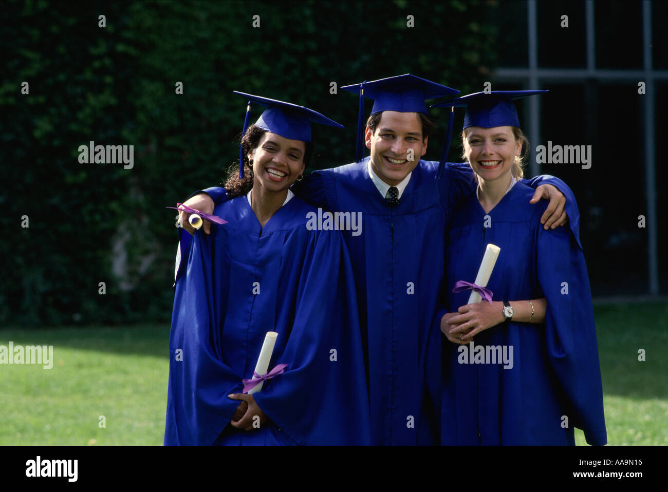 Portrait of a group of students wearing graduation outfits Stock Photo ...