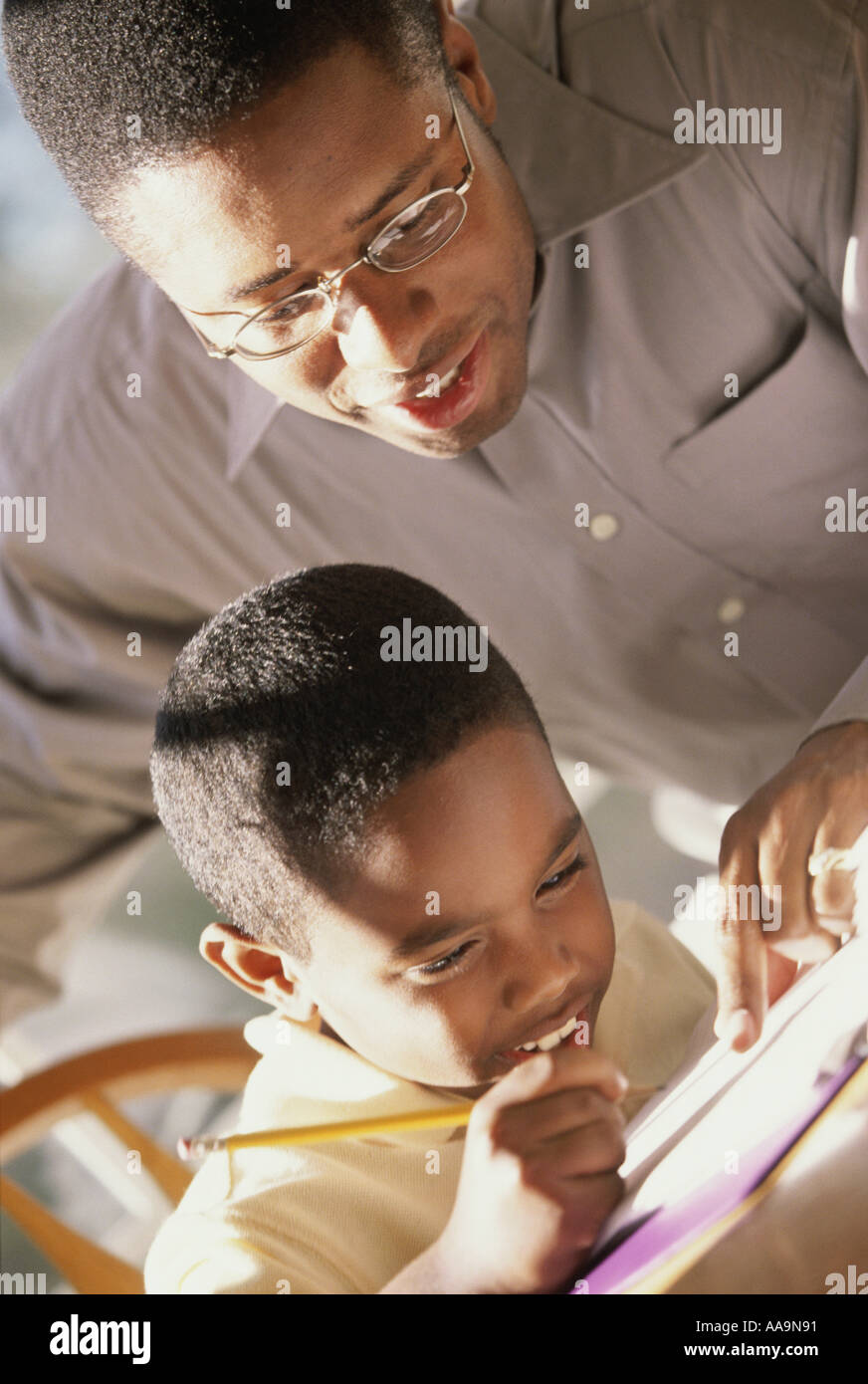 African children father homework hi-res stock photography and images - Alamy