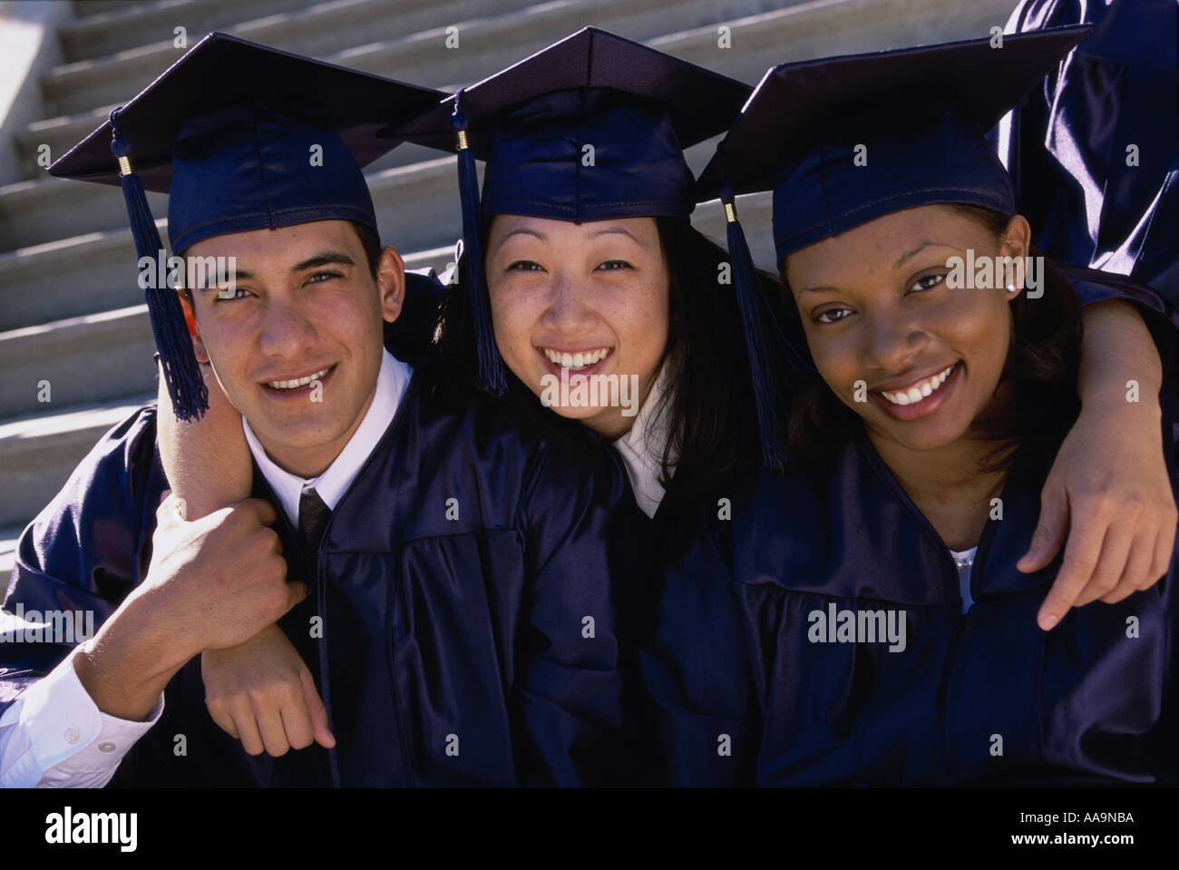 Portrait of a group of students wearing graduation outfits Stock Photo ...