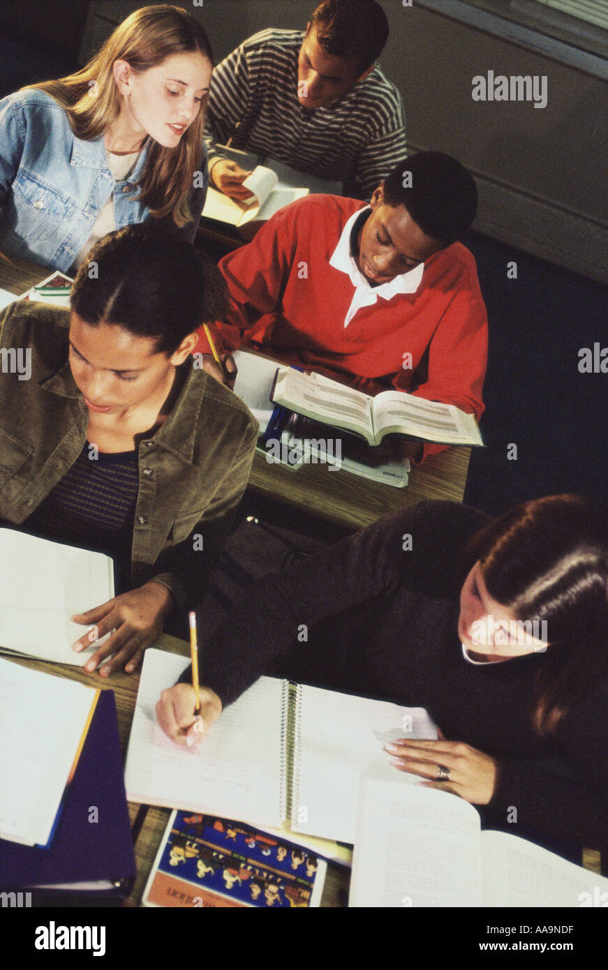 High angle view of teenage students taking a test in class Stock Photo ...