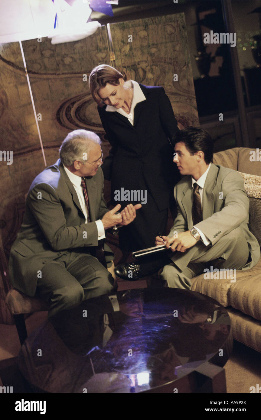 Three business executives talking Stock Photo - Alamy