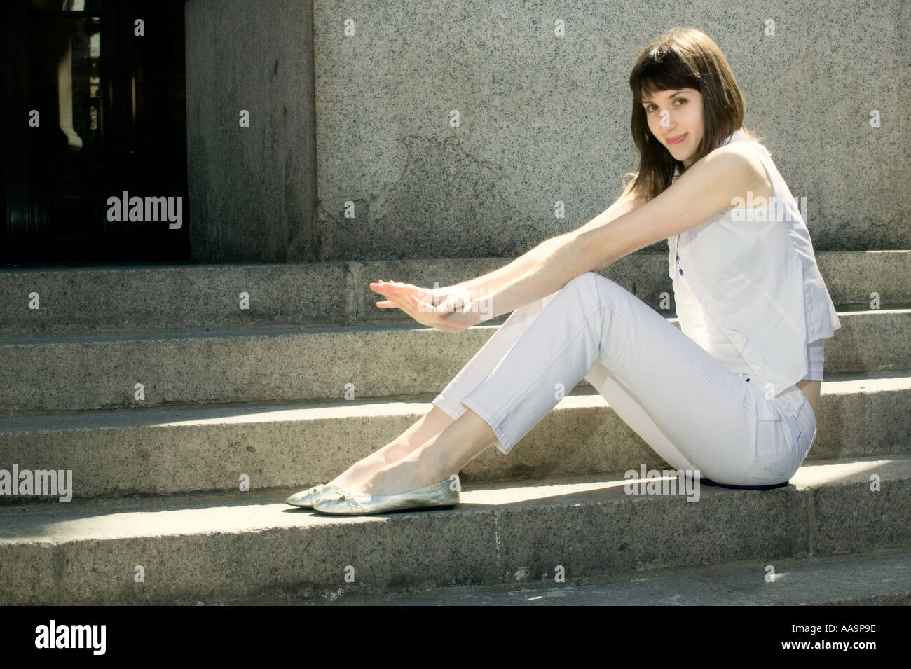 Girl Sitting on Steps Stock Photo - Alamy