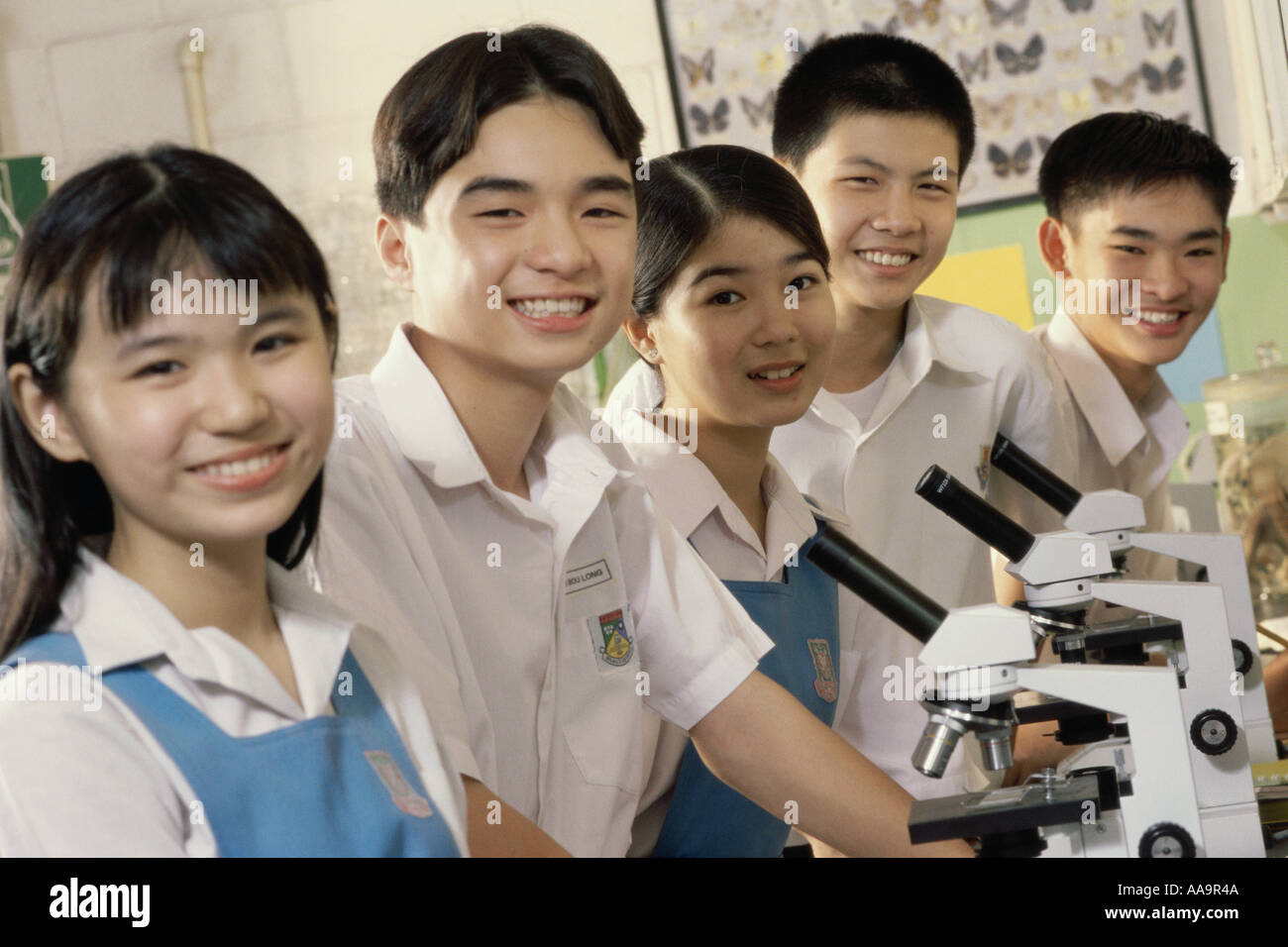 Portrait of teenage students in a science laboratory Stock Photo - Alamy