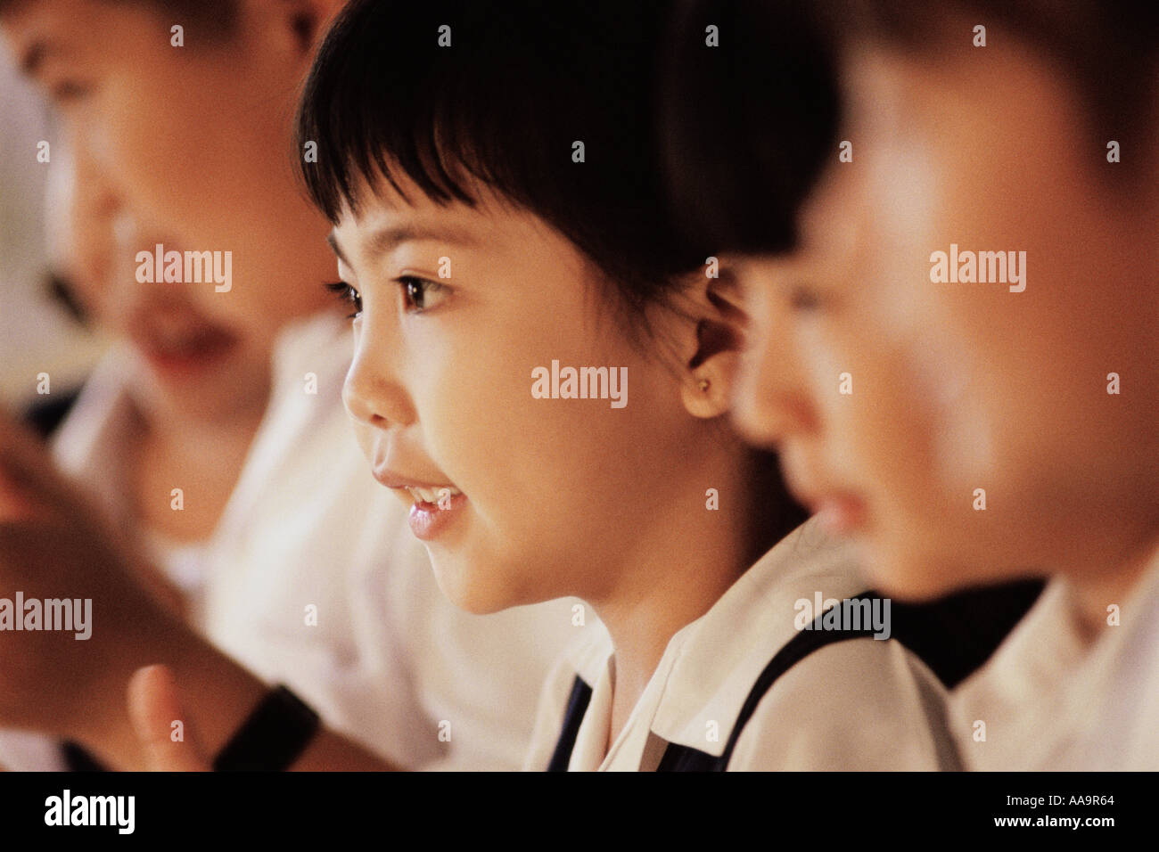 Side profile of a girl in class Stock Photo - Alamy