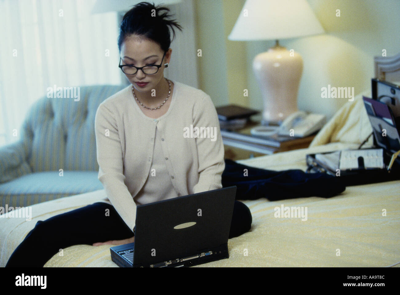 Asian woman operating laptop hi-res stock photography and images - Alamy
