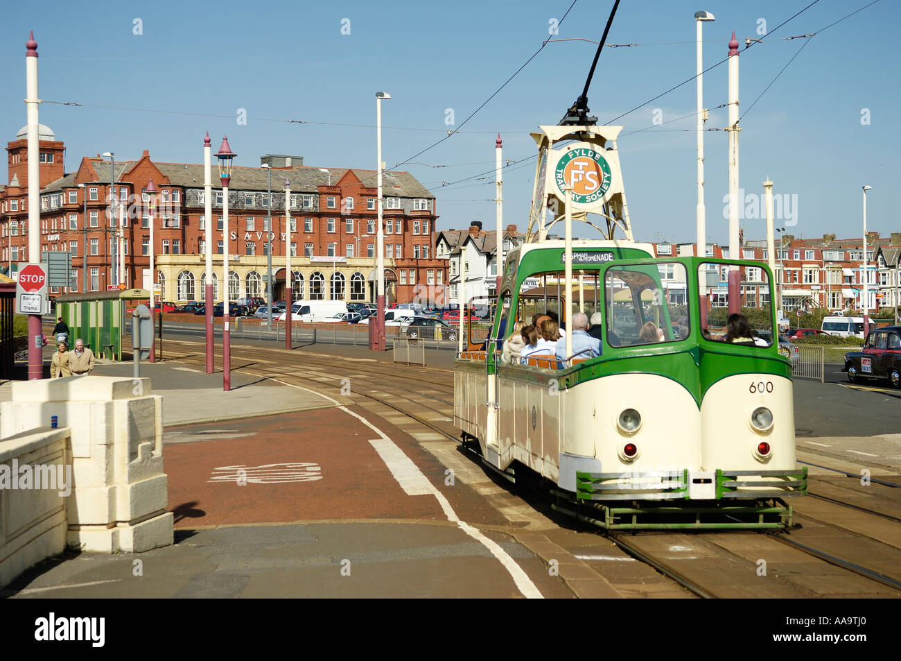 Single deck open top tram passing the savoy Hotel at Gynn Square ...