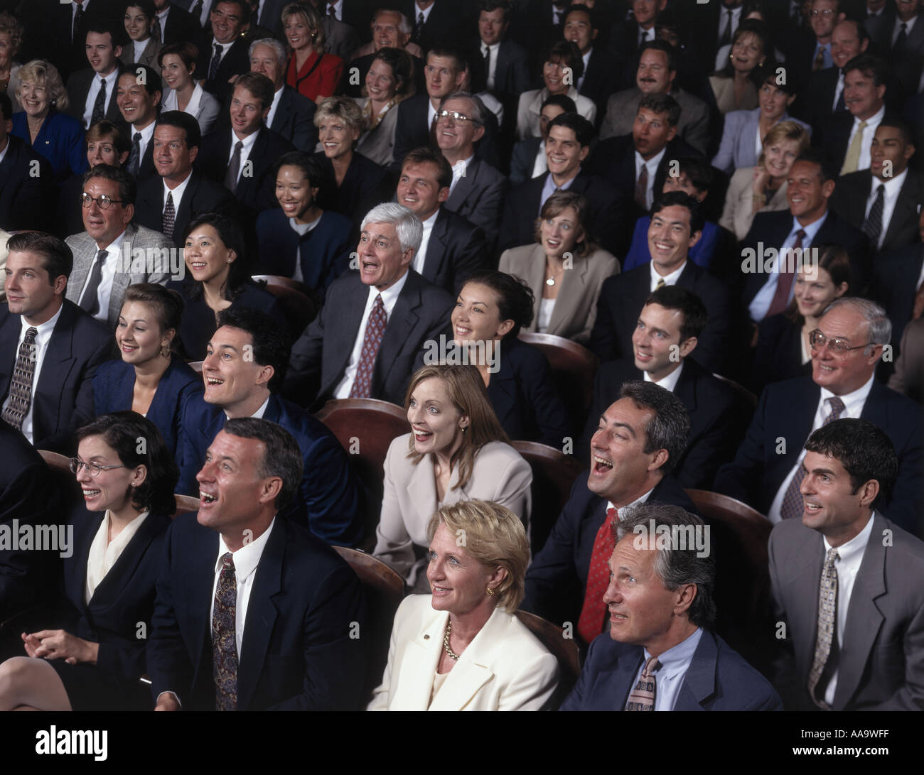 Crowd of business executives together in a hall Stock Photo - Alamy