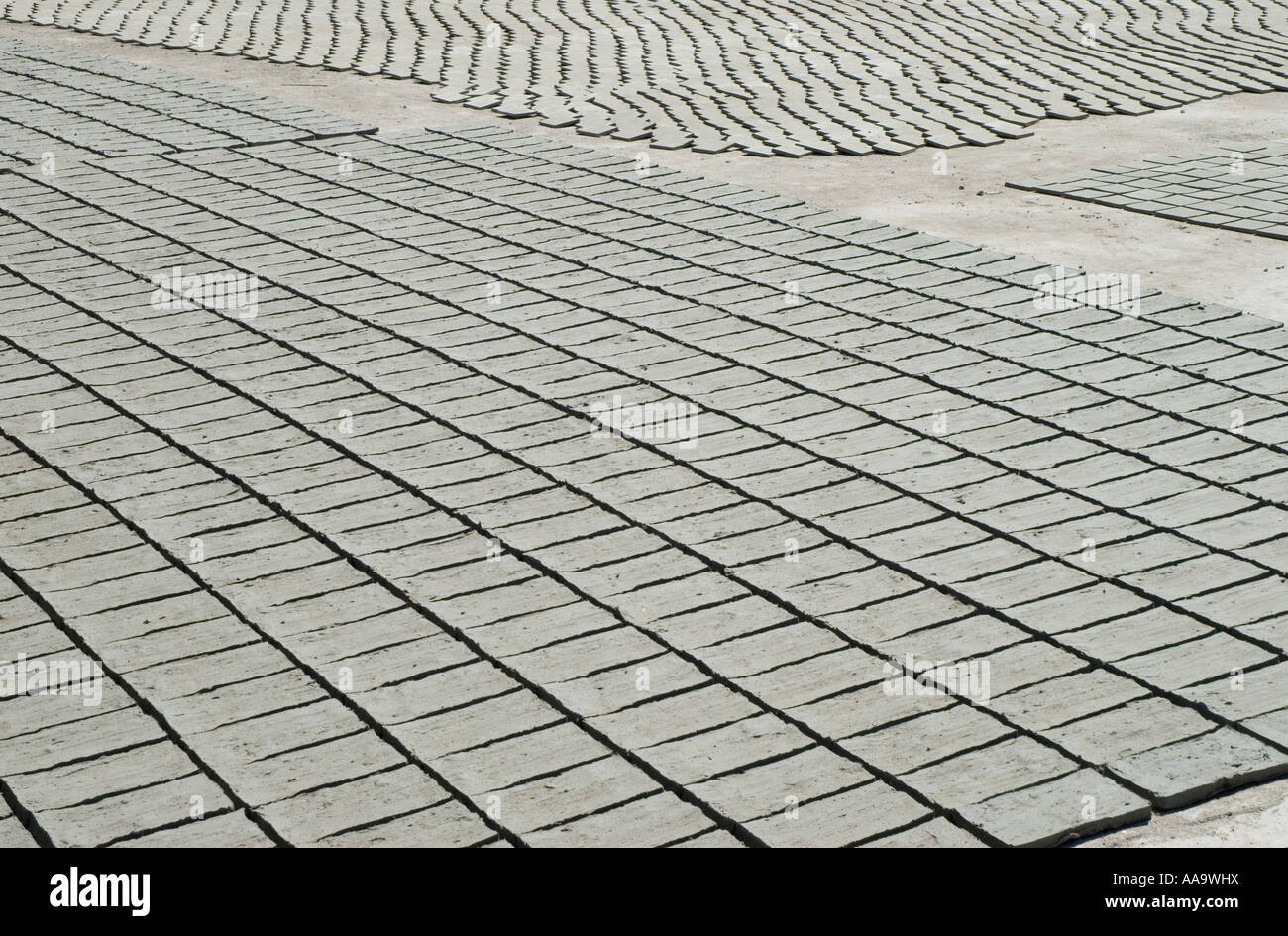 Lines of cut clay tiles dry in the sun at a pottery, Fez, Morocco Stock ...