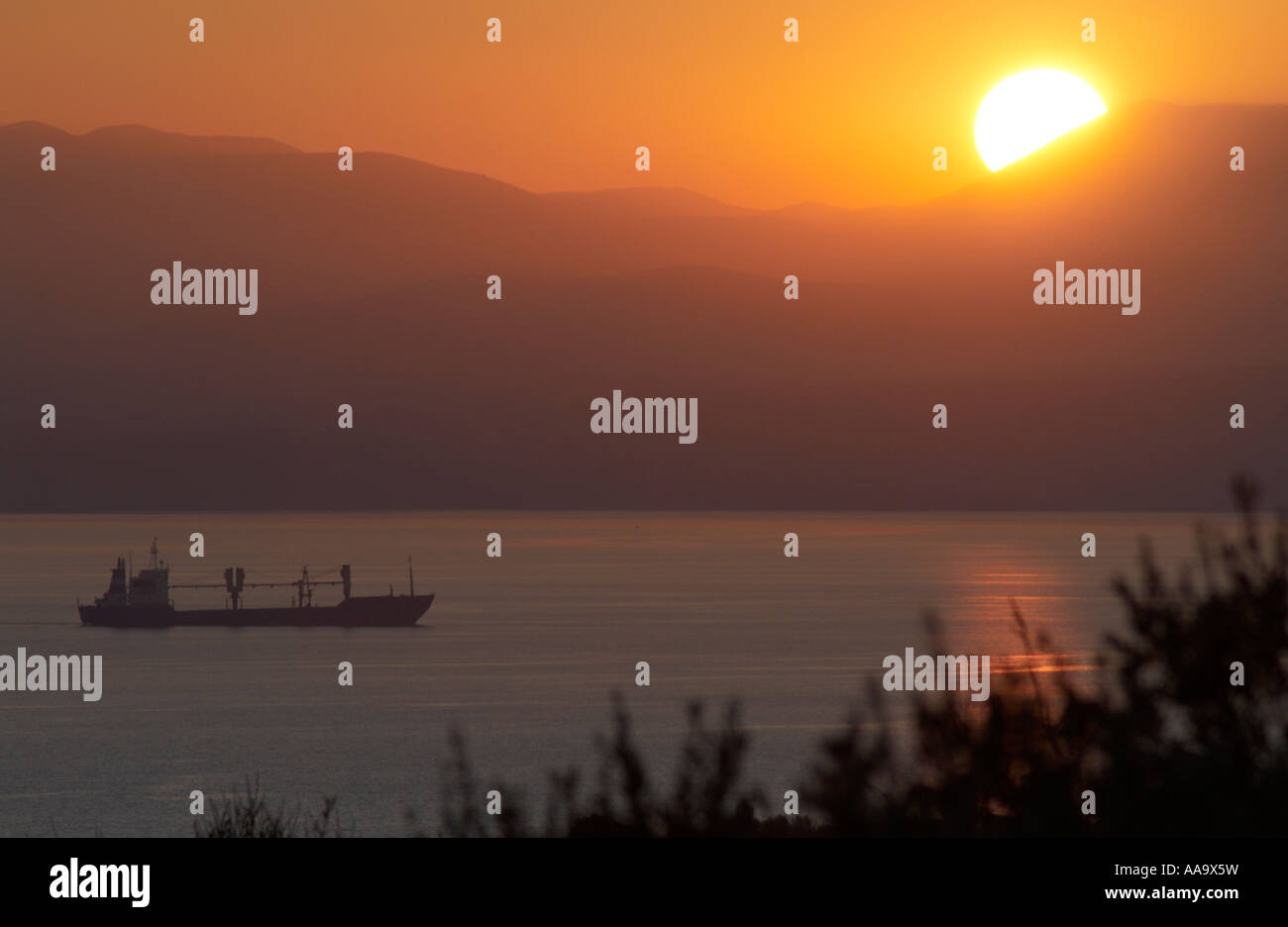 Ship at Sunset Stock Photo - Alamy