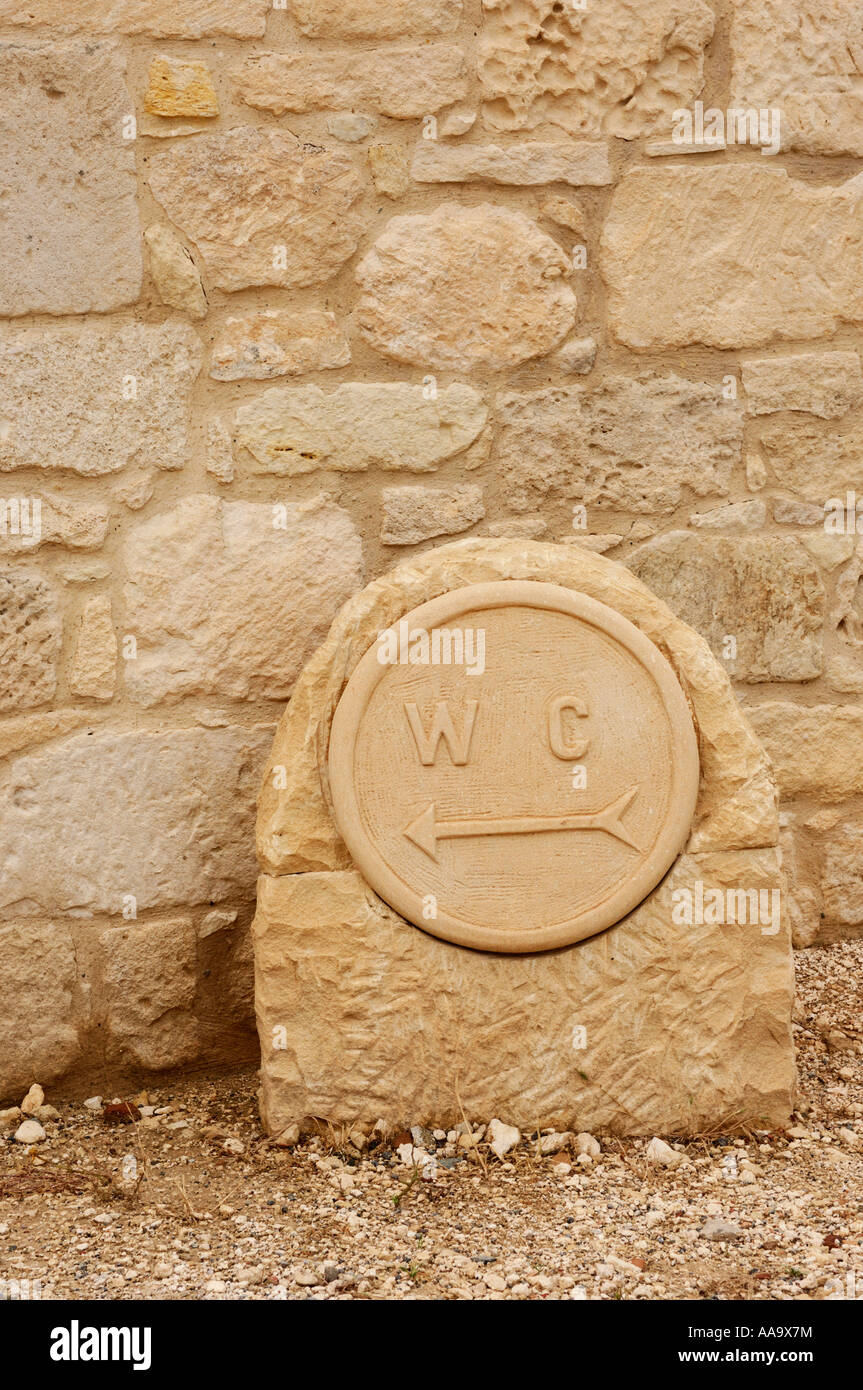 WC sign carved in stone Stone wall Sandstone Stock Photo - Alamy