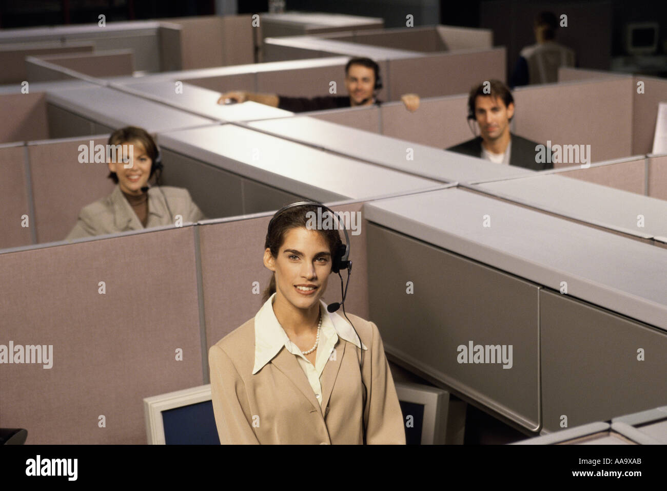 Portrait of customer service representatives in cubicles Stock Photo ...