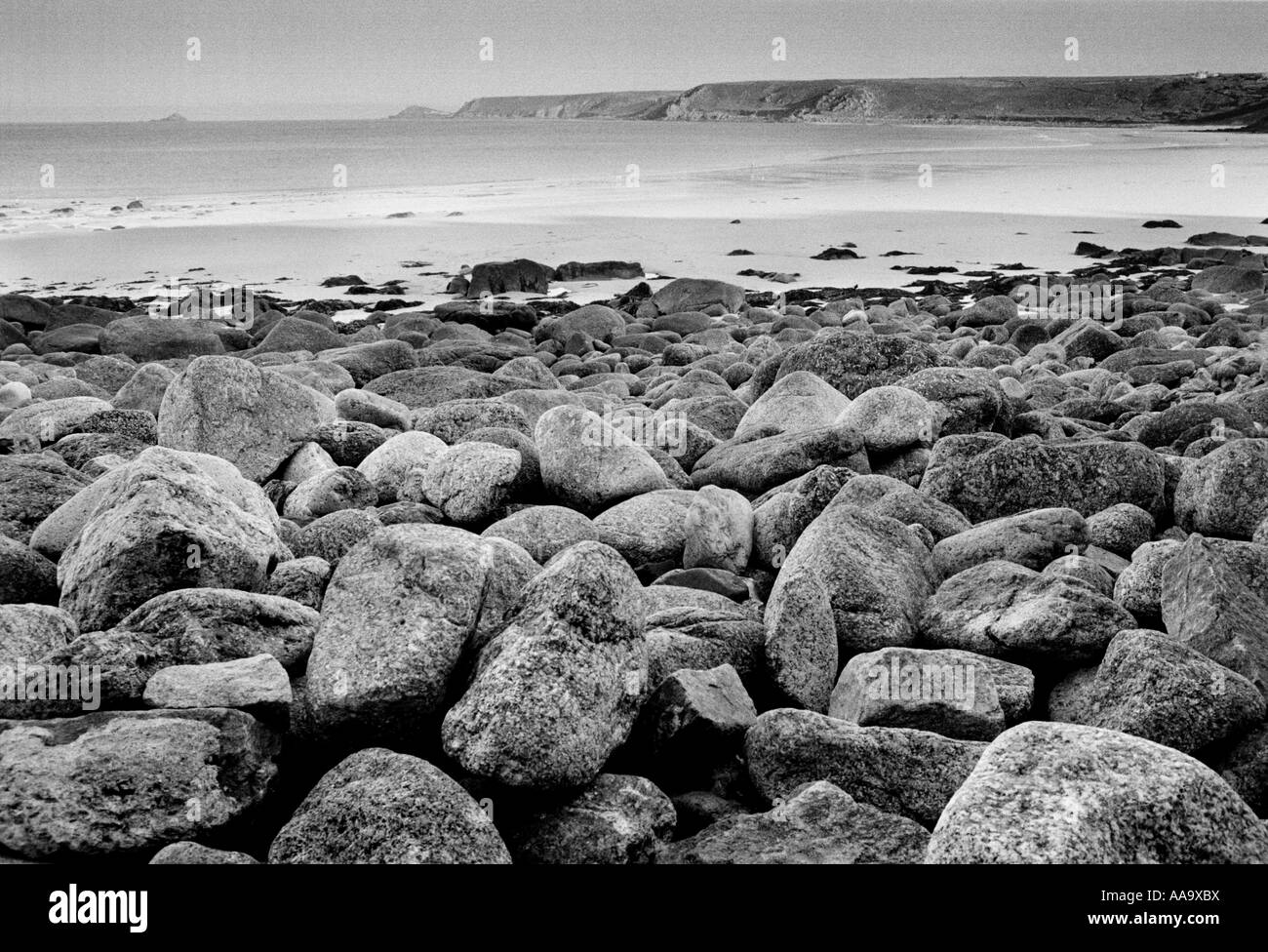 Large stones cover St Loy's Cove, Cornwall, part of the south west ...
