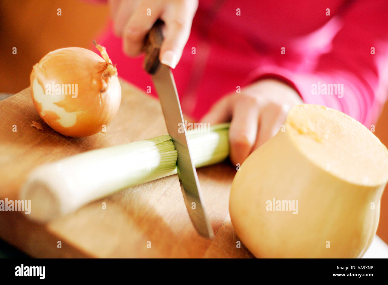 Woman chopping vegetables Stock Photo - Alamy