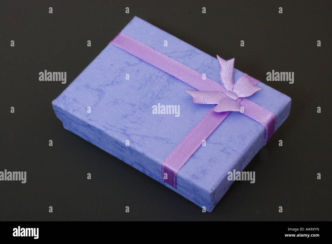 gift wrapped box on black background Stock Photo - Alamy