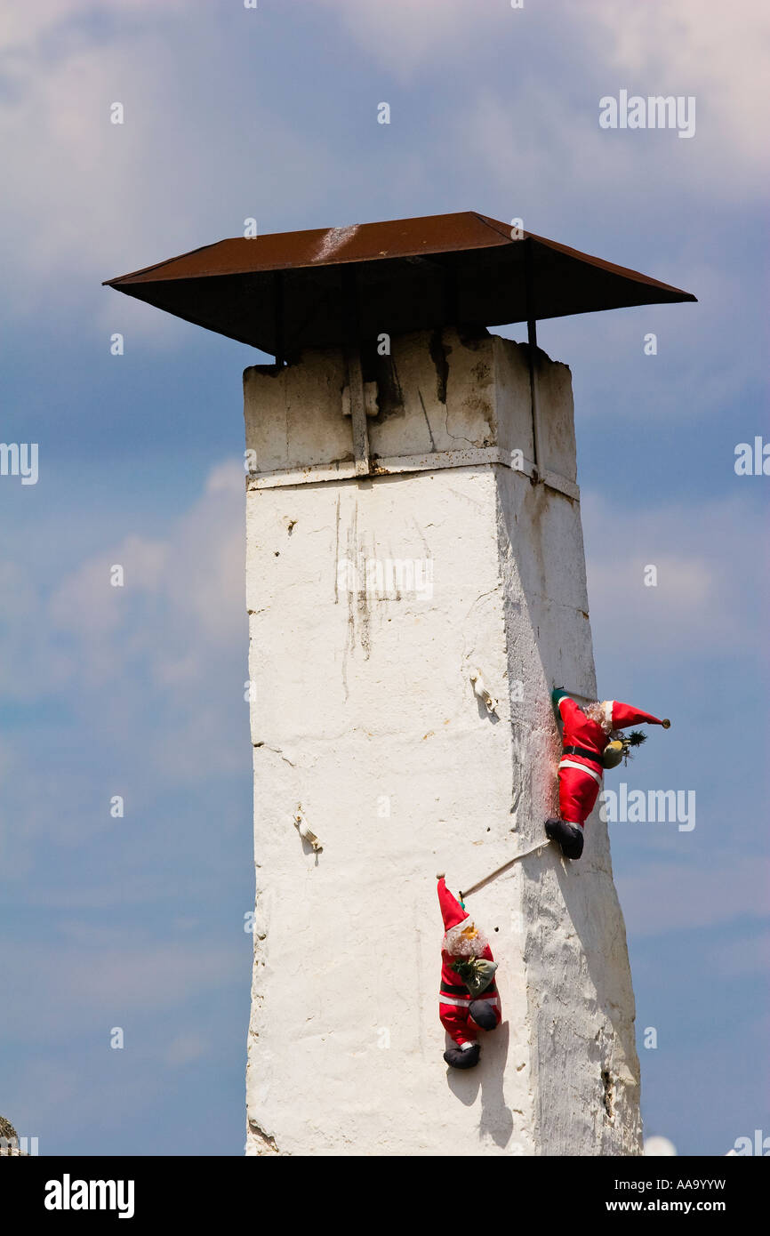 Santa claus climbing chimney hi-res stock photography and images - Alamy