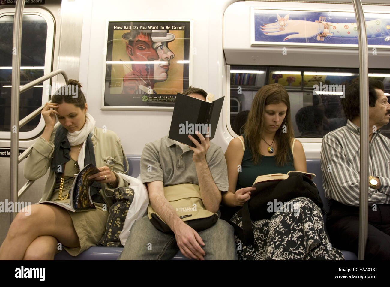 Lexington Avenue IRT NYC Passengers reading as they ride the subway in ...