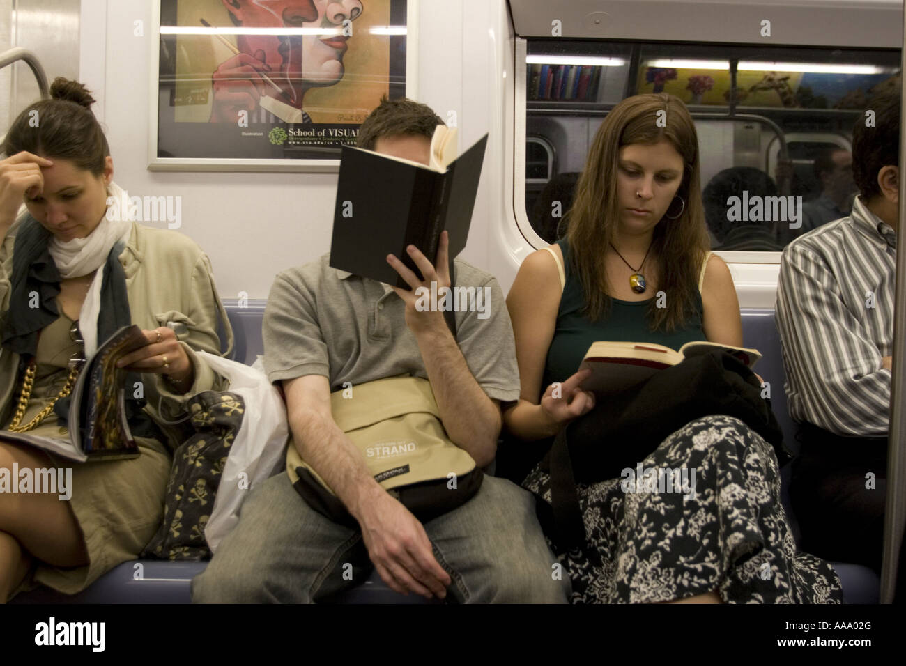Lexington Avenue IRT NYC Passengers reading as they ride the subway in ...
