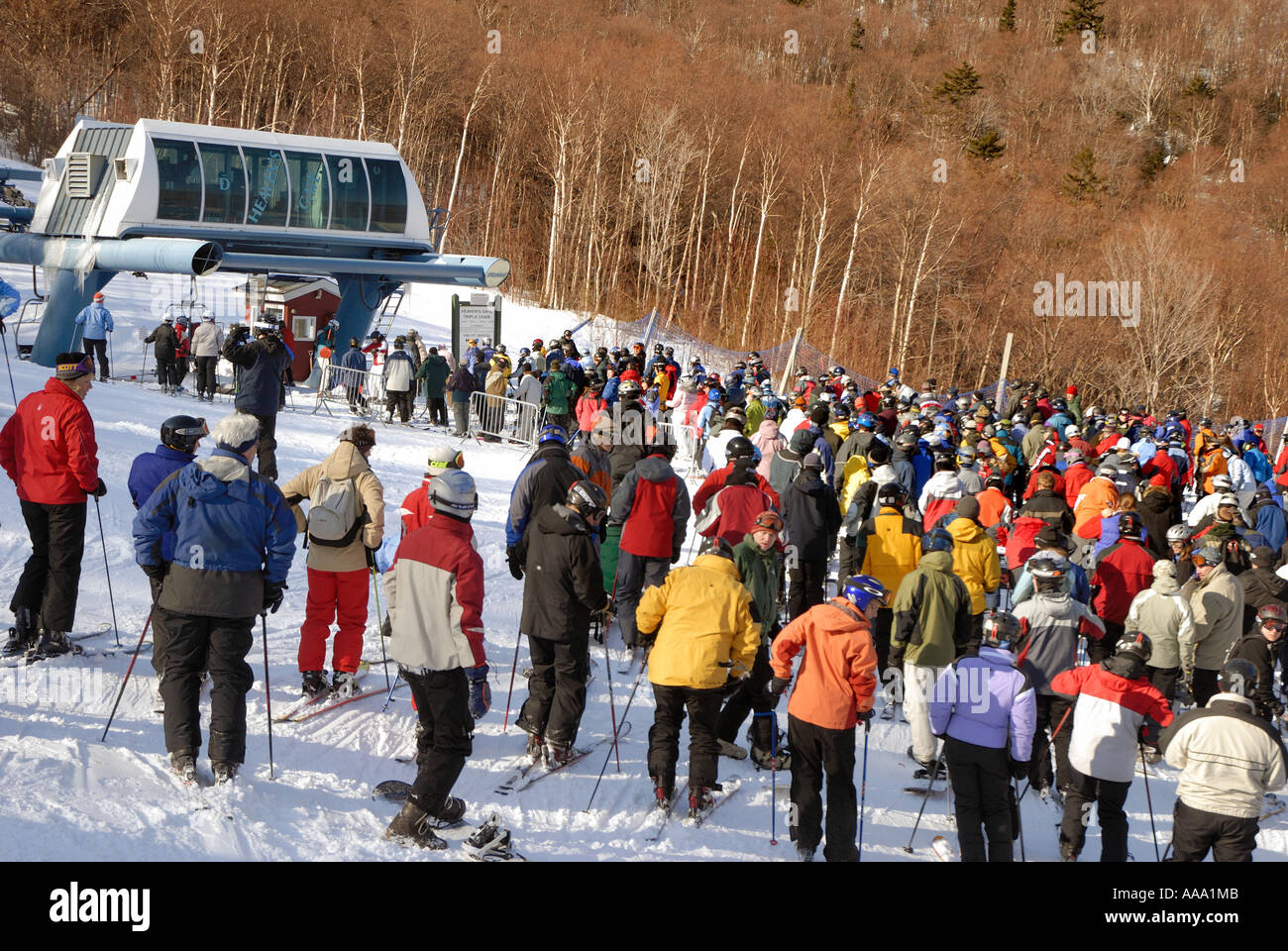 A crowd of skier wait to go up the lift at a New England ski resort ...