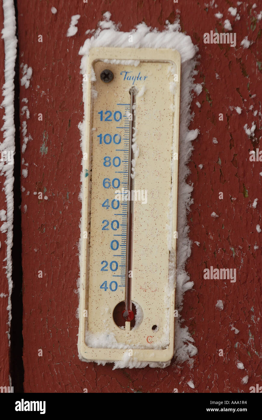 A thermometer covered in frost during freezing temperatures in New ...