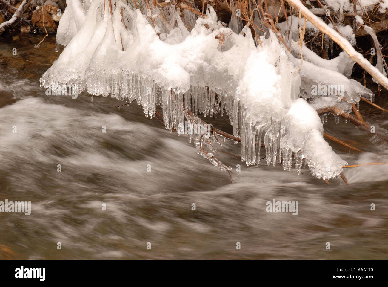 Waters flows in a brook in the spring, as ice begins to melt in New ...