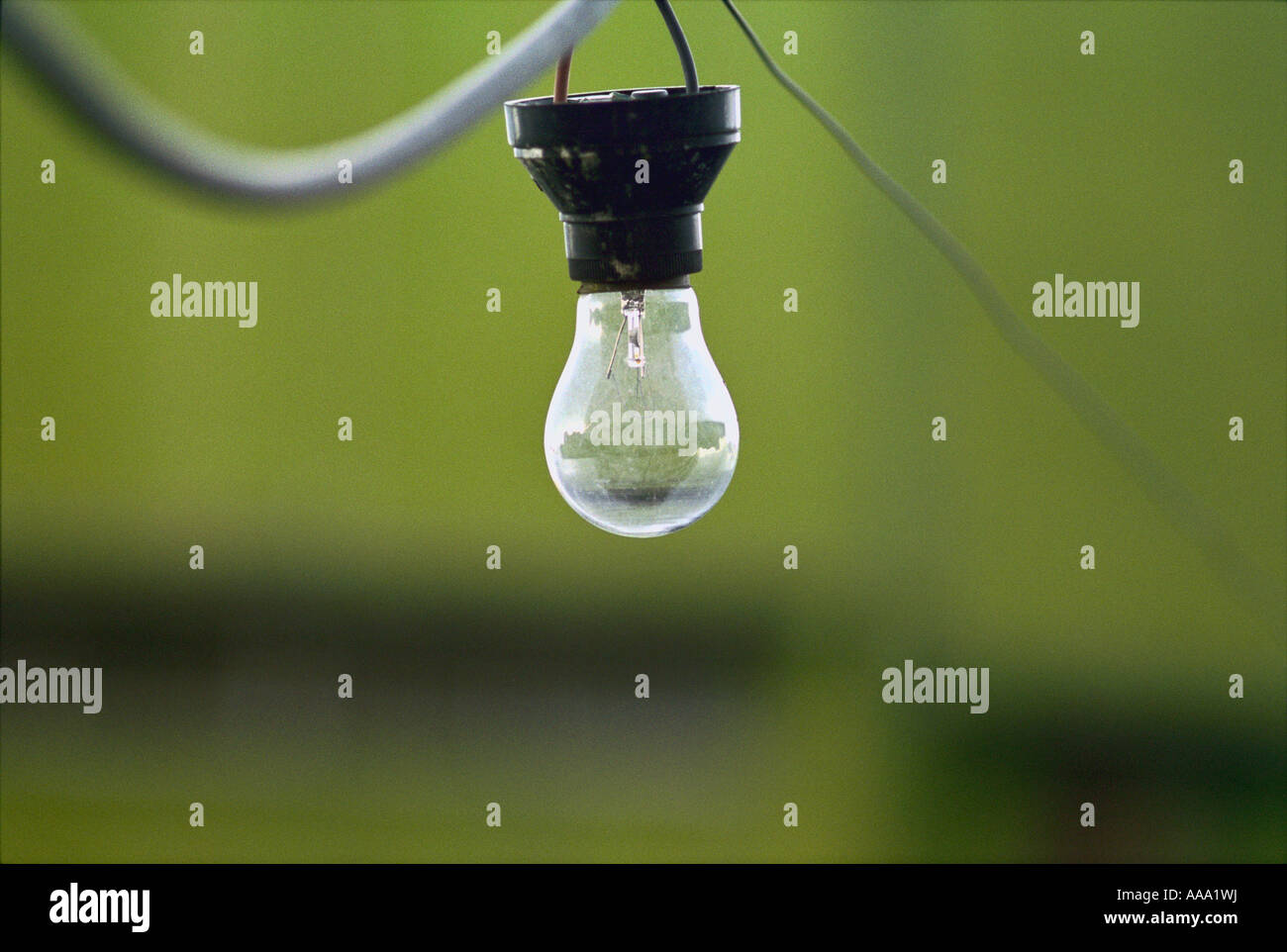 A hanging incandescent lightbulb Stock Photo - Alamy