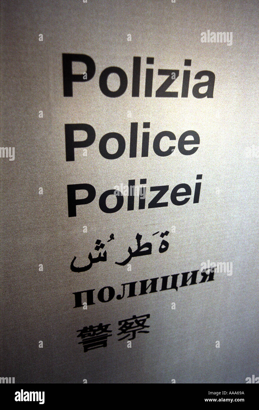 Sign for police in several different languages Stock Photo: 698010 - Alamy