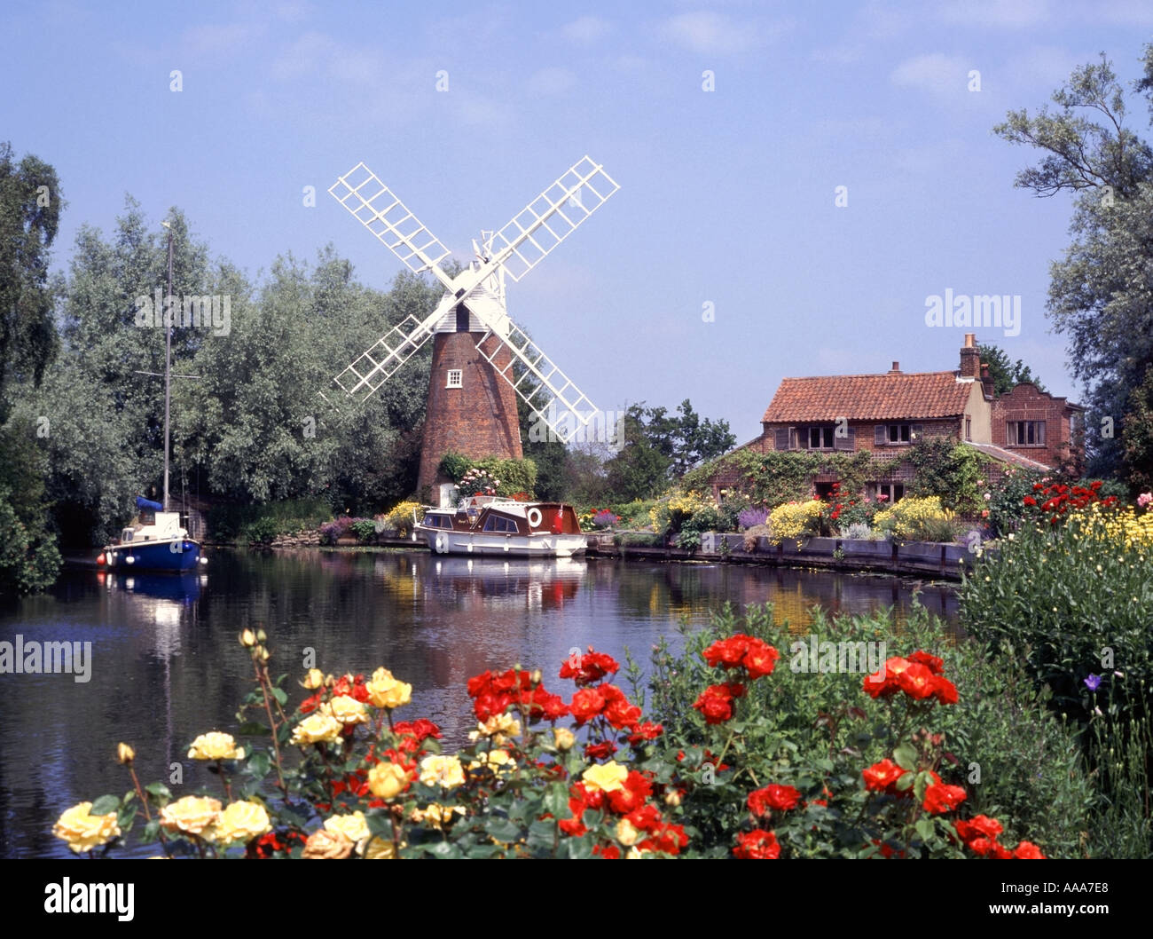 Hunsett Mill windmill on Norfolk Broads in English cottage garden a ...