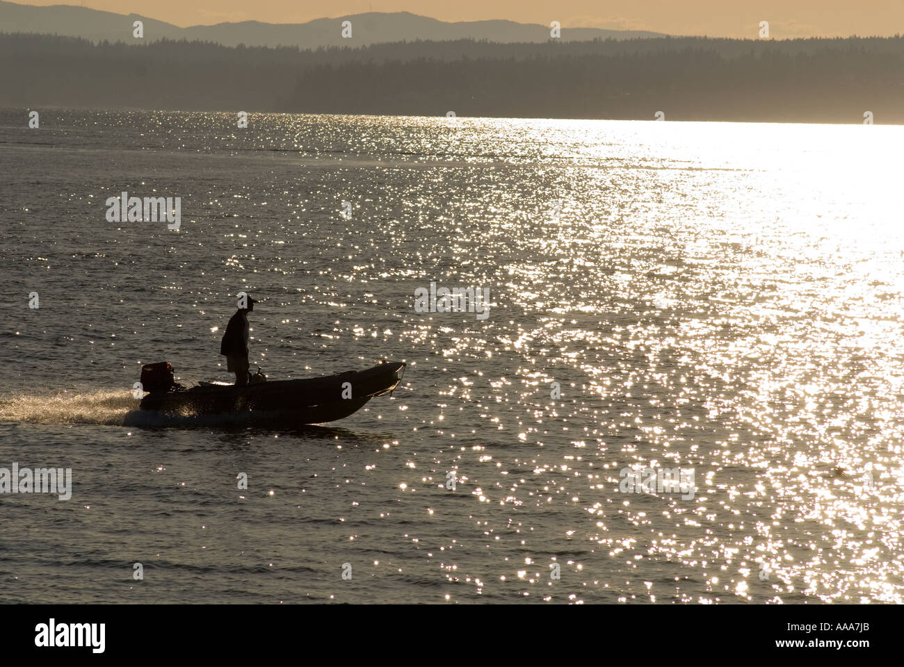 man in small boat Stock Photo - Alamy