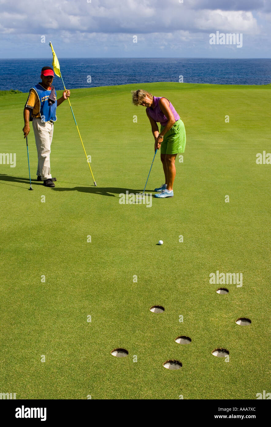 Senior woman improving her luck at golf course Stock Photo - Alamy