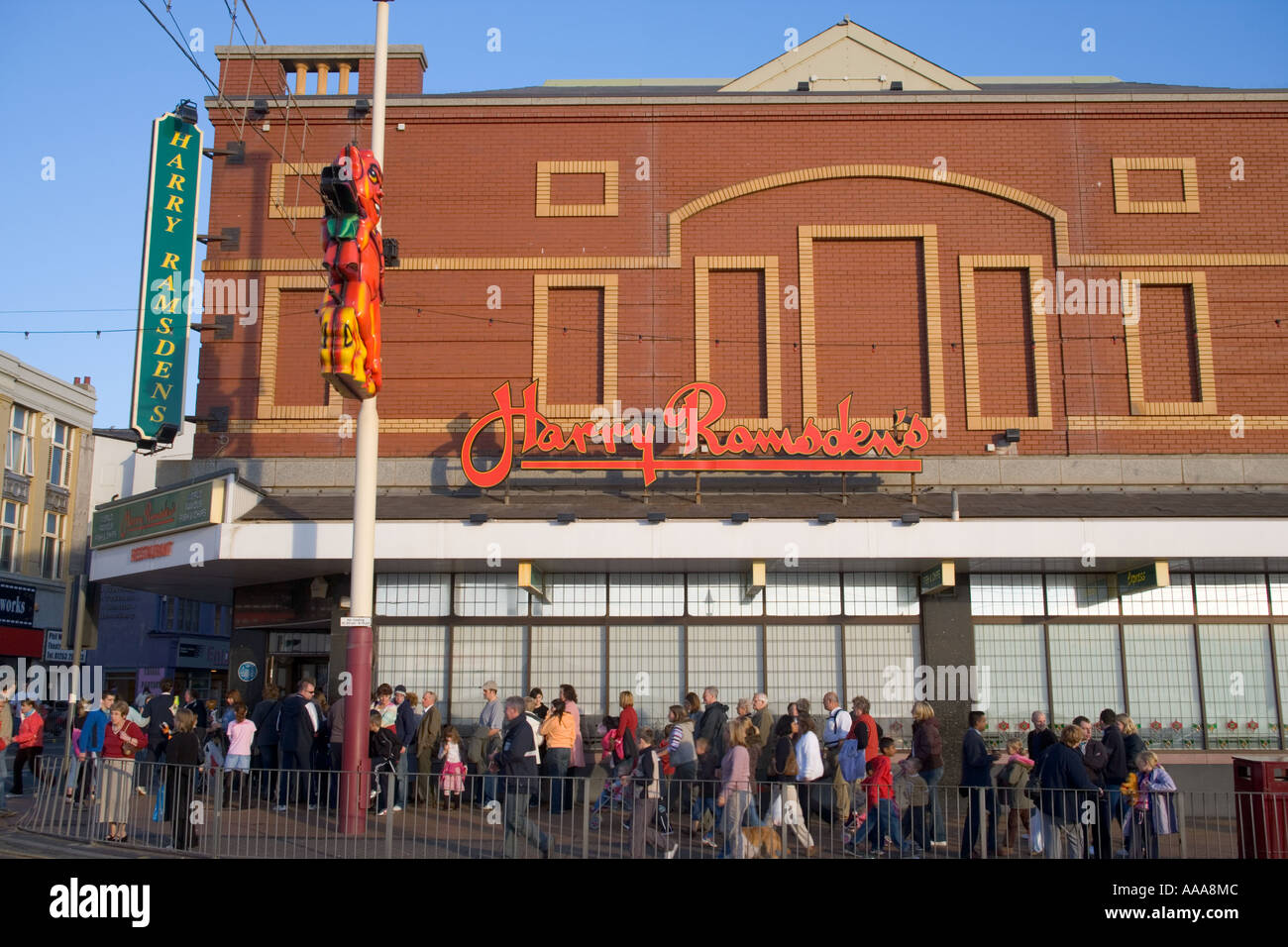 Queue outside Harry Ramsden's World Famous Fish and Chip Restaurant ...