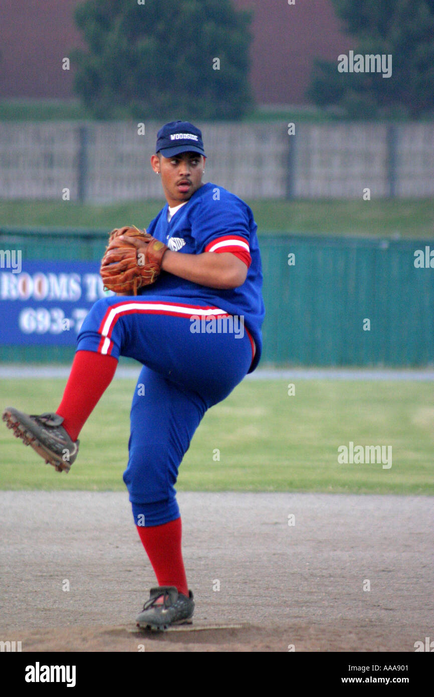 Black teen boy pitching Stock Photo - Alamy