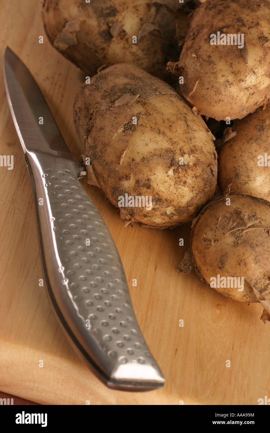New Potatoes and a Vegetable Knife Stock Photo - Alamy