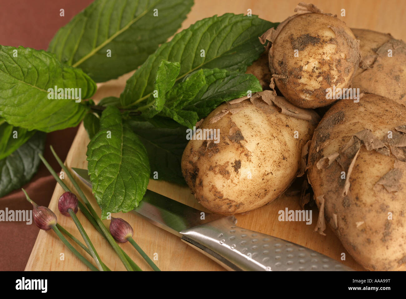 New Potatoes Mint Chives and a Vegetable Knife Stock Photo - Alamy