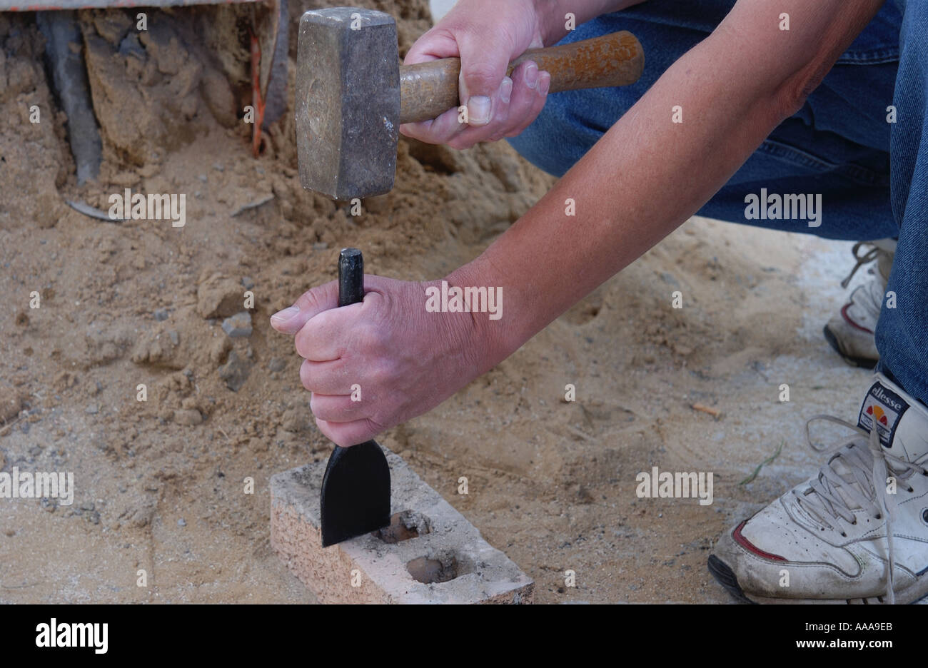 hand holding bolster chisel and hammer Stock Photo - Alamy